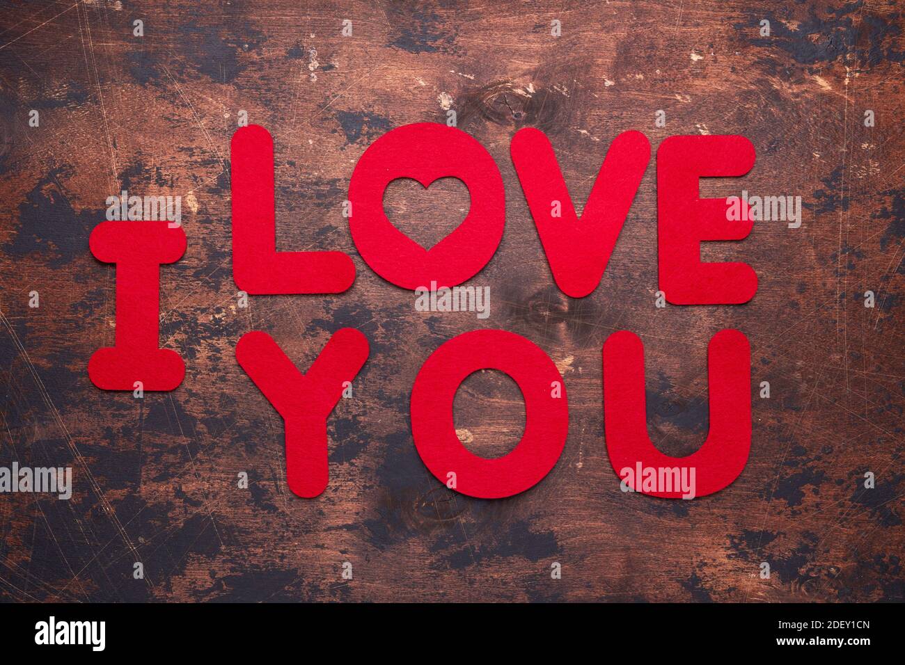 Words I Love You on old wooden background Red textile letters Top view ...
