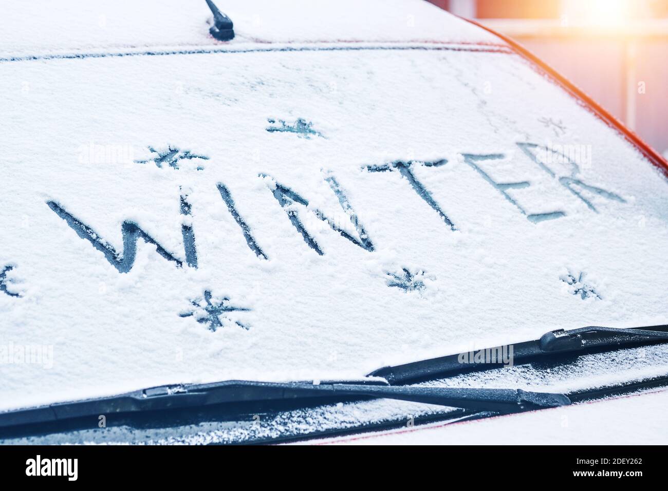 word Winter written with finger on a snowy windshield of a car Stock ...