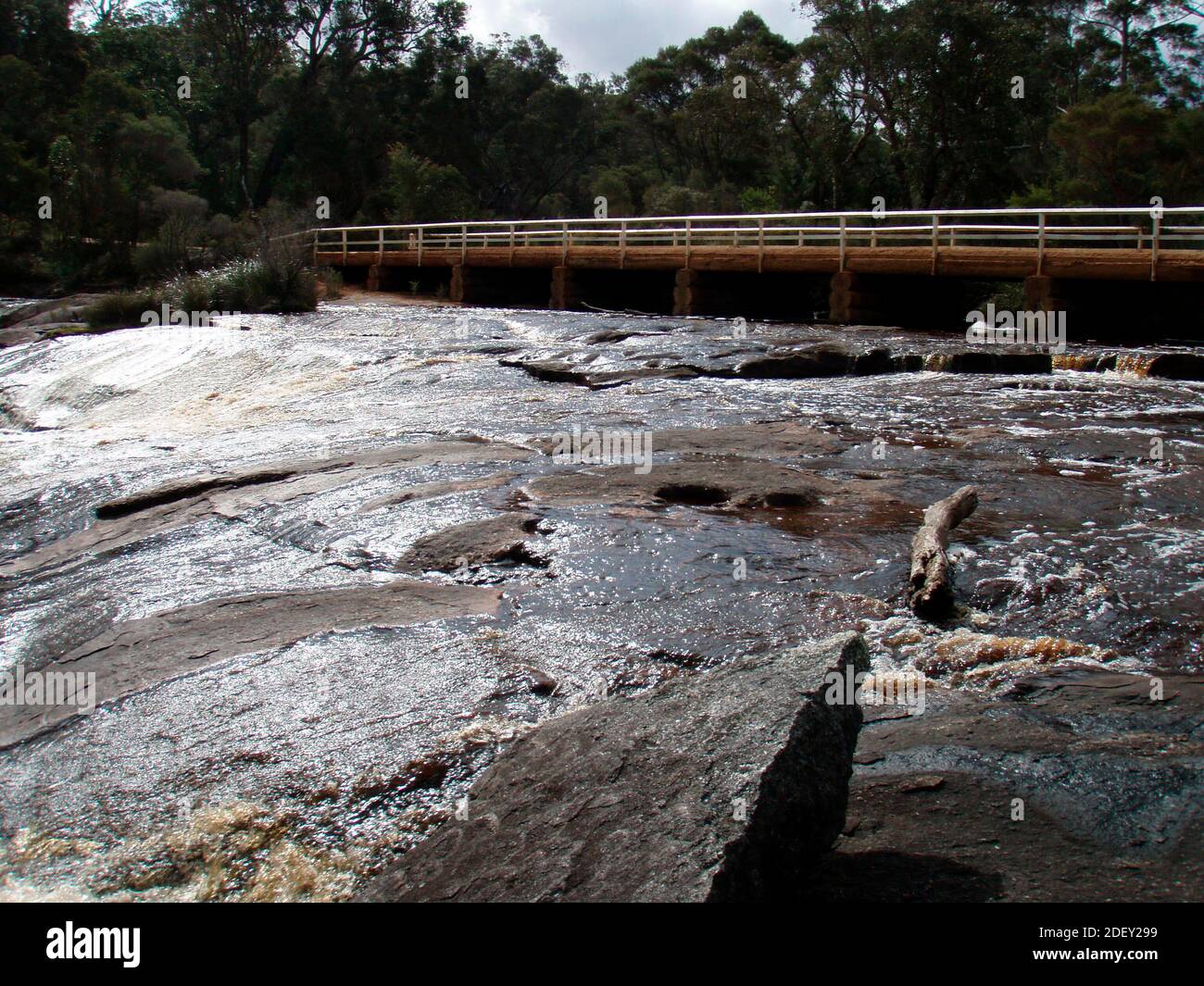 a wooden bridge as a structure that crosses natural obstacles for ...