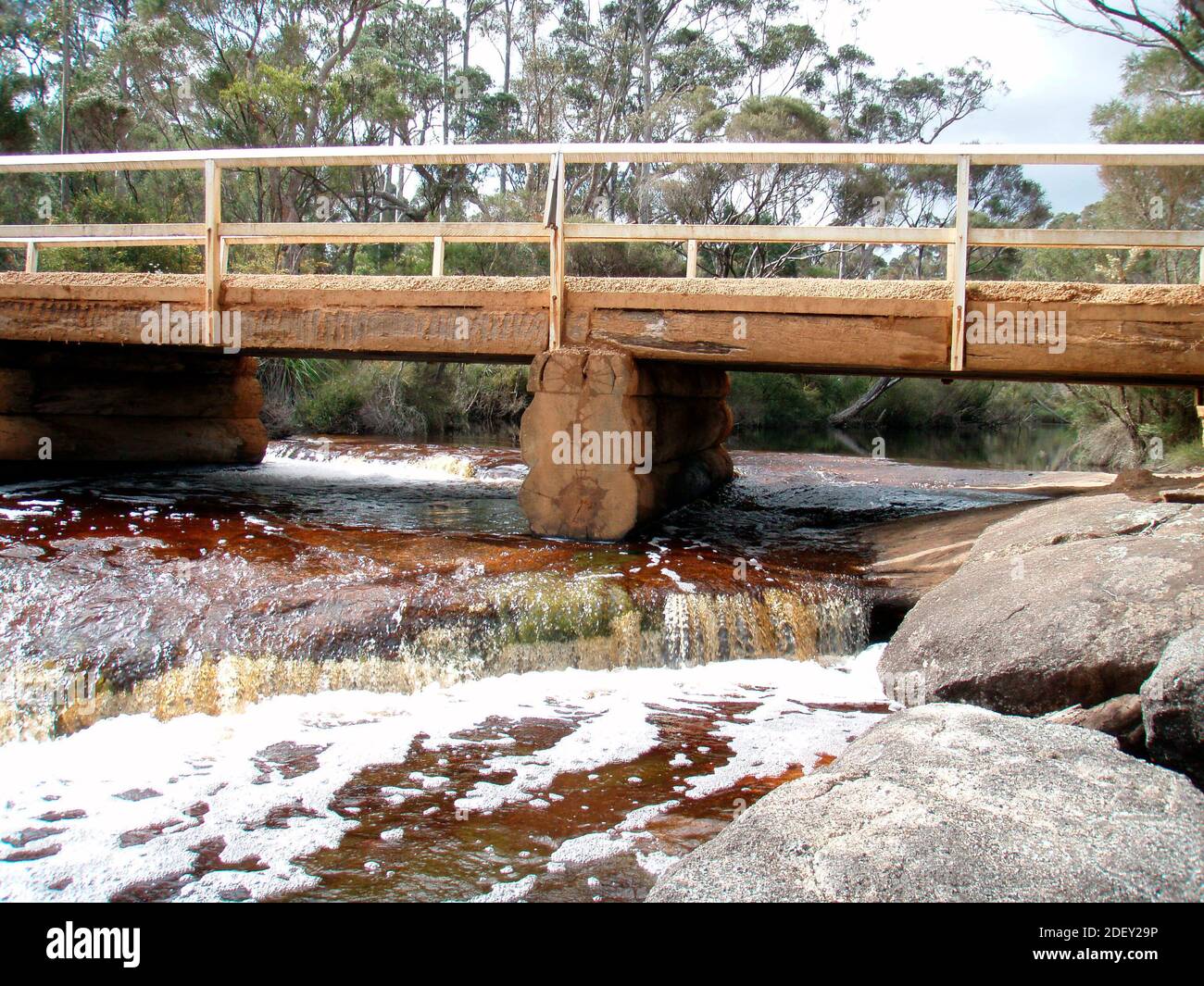 a wooden bridge as a structure that crosses natural obstacles for ...