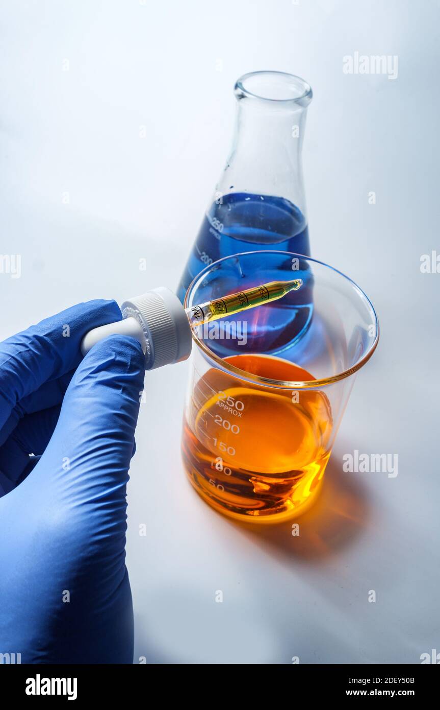 Close up glass measuring beaker for science experiment background Stock ...