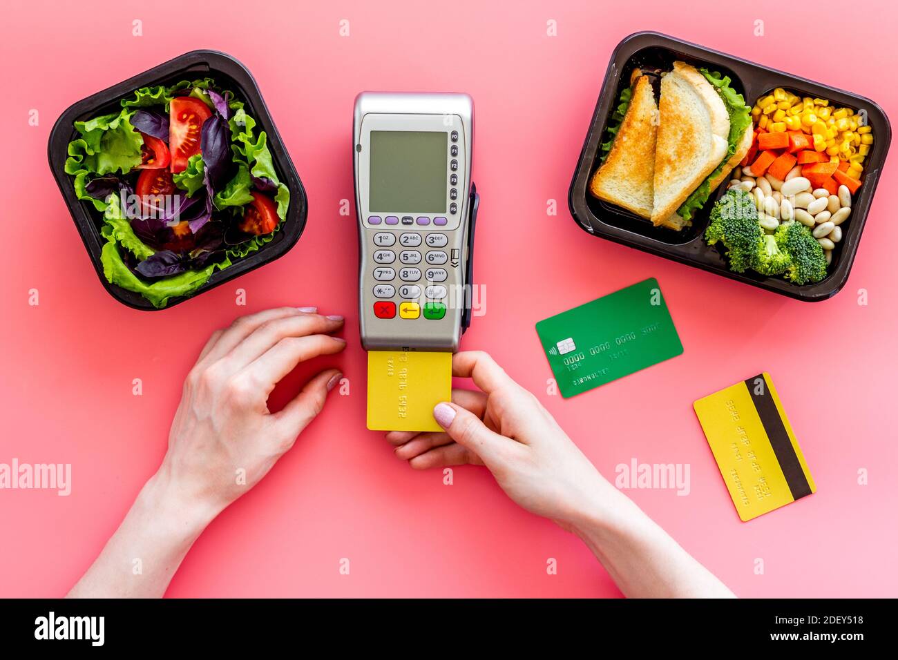 Hands with credit card and payment terminal. Restaurant food delivery ...