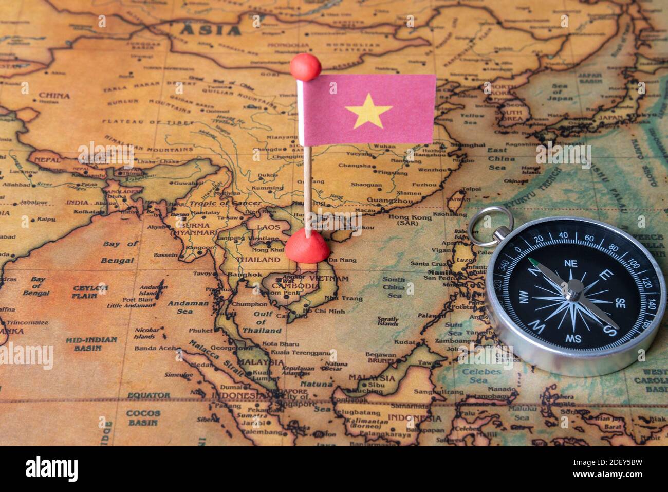 Vietnam flag and compass on the world map. The concept of travel and ...