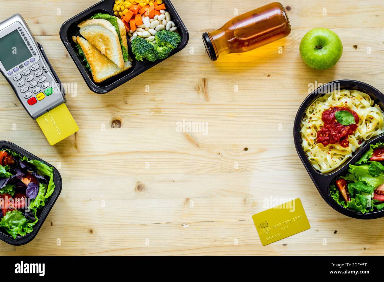Lunch at workplace. Delivery boxes with meal, top view Stock Photo - Alamy