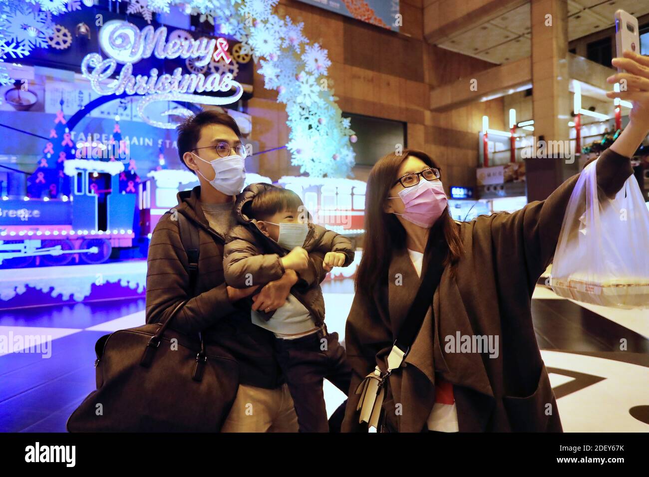 Taipei, Taipei, Taiwan. 2nd Dec, 2020. A family of three pose for a ...