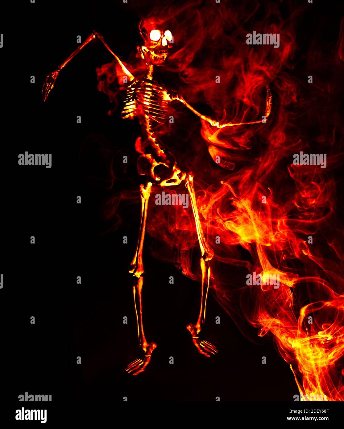 Scary demon Halloween skeleton dances in deadly fire Stock Photo - Alamy