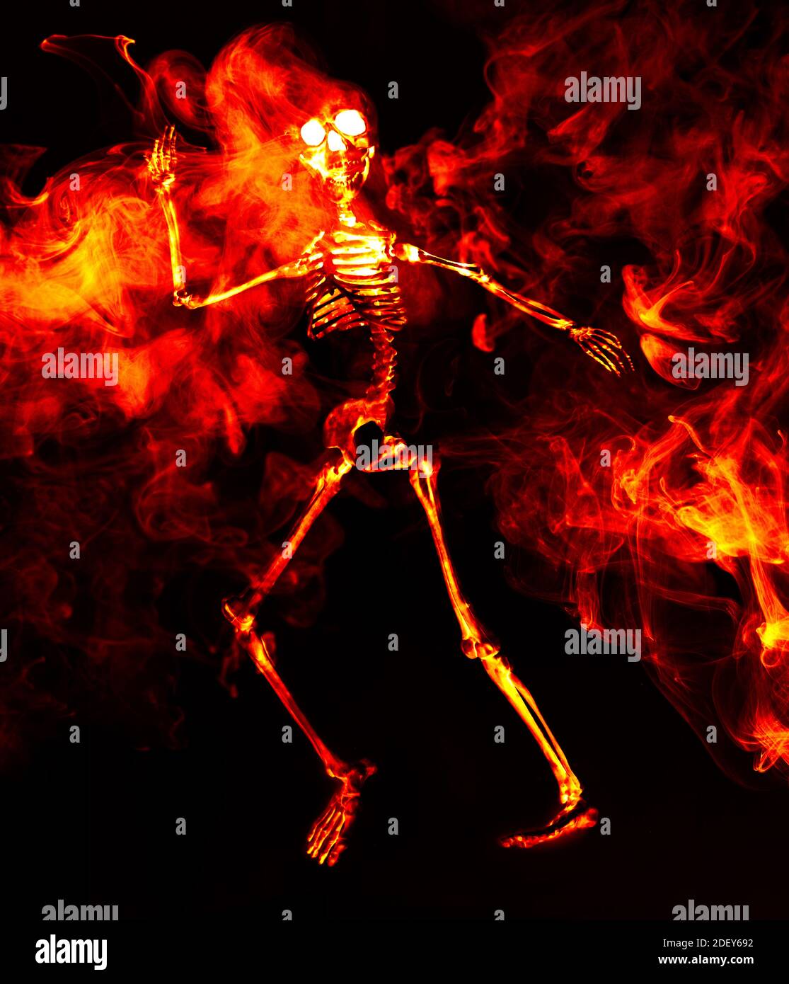 Scary demon Halloween skeleton dances in deadly fire Stock Photo - Alamy