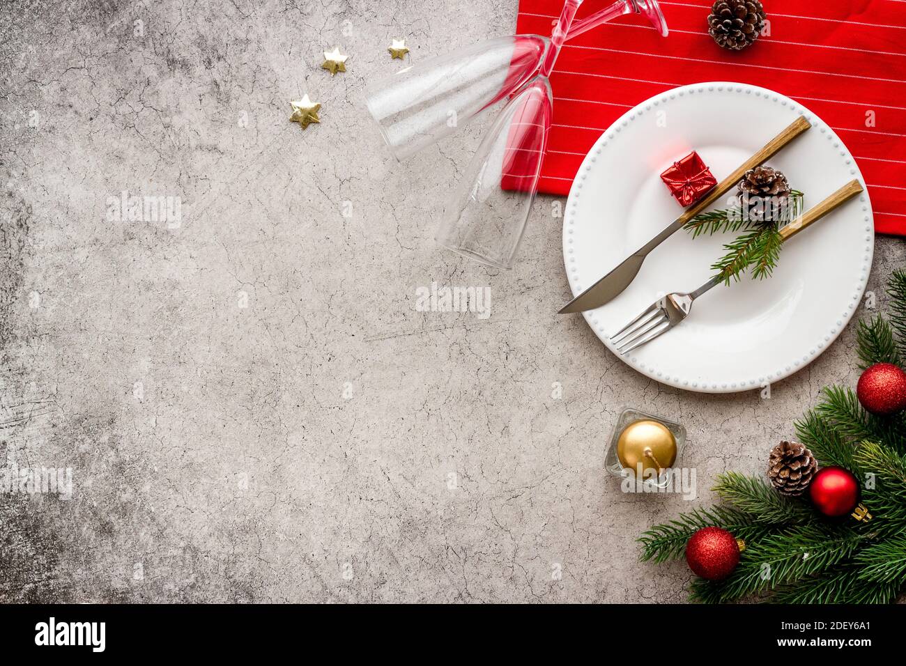 Frame of Christmas table setting with fir tree and empty plate, top ...