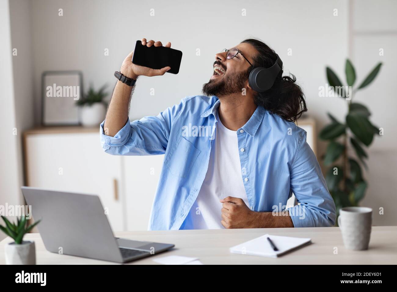 Businessman singing microphone hi-res stock photography and images - Alamy
