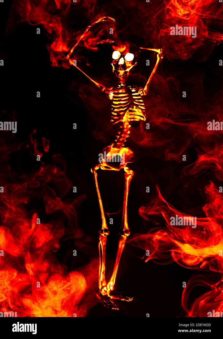 Scary demon Halloween skeleton dances in deadly fire Stock Photo - Alamy