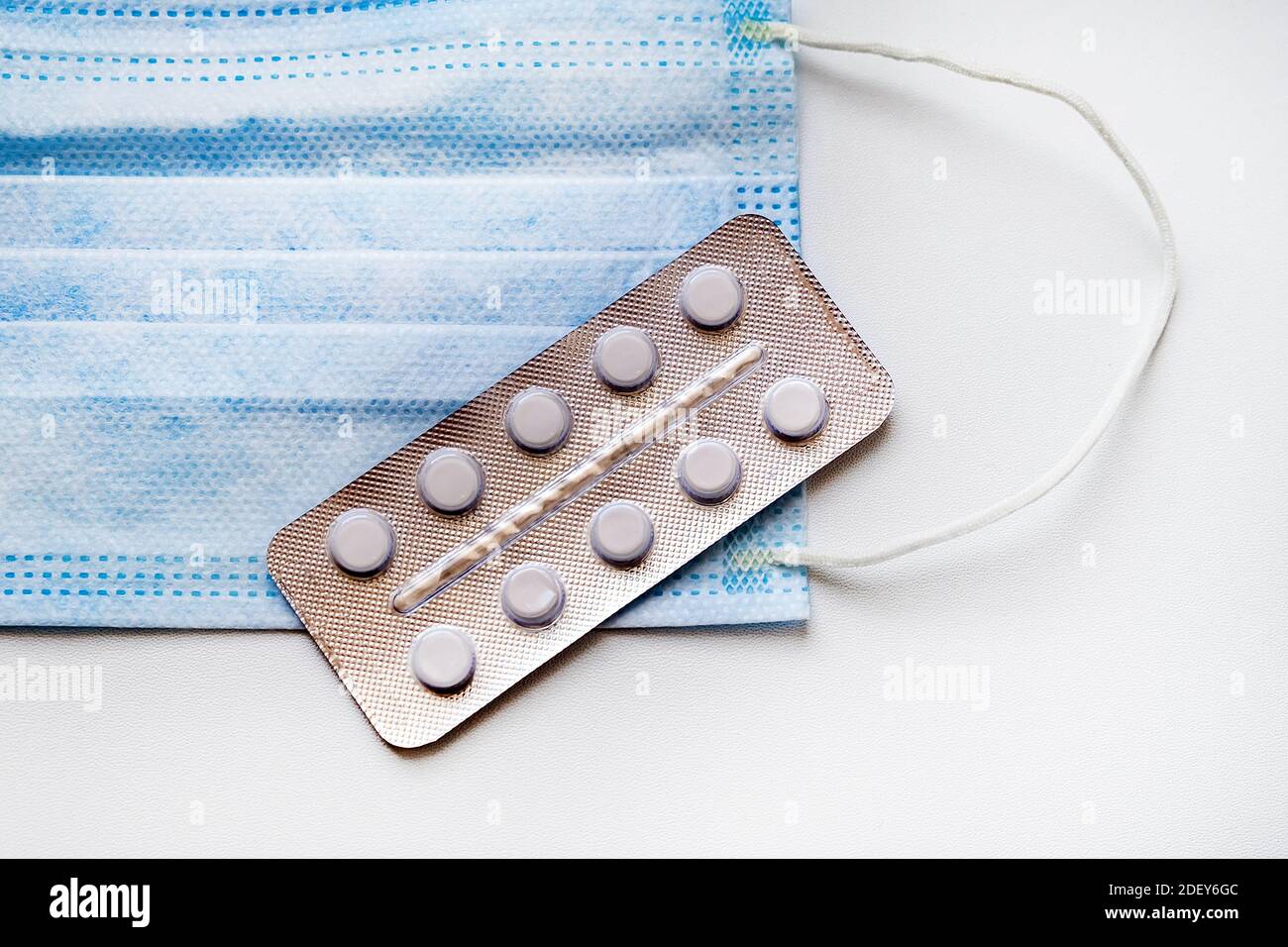 Protective Medical Flu Mask with a Pills on the White Background ...