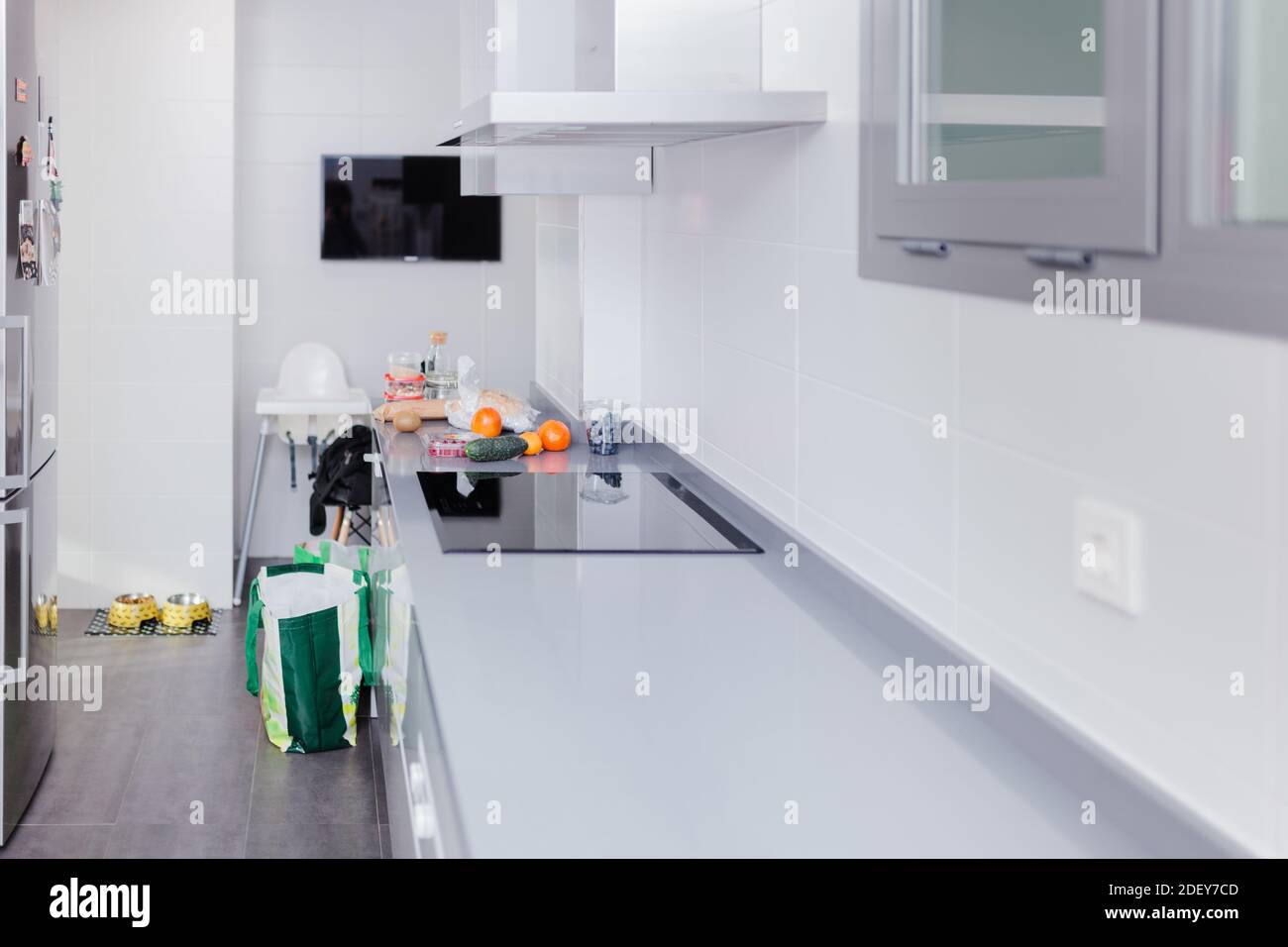 Kitchen of a house with products to prepare healthy food and some bags ...