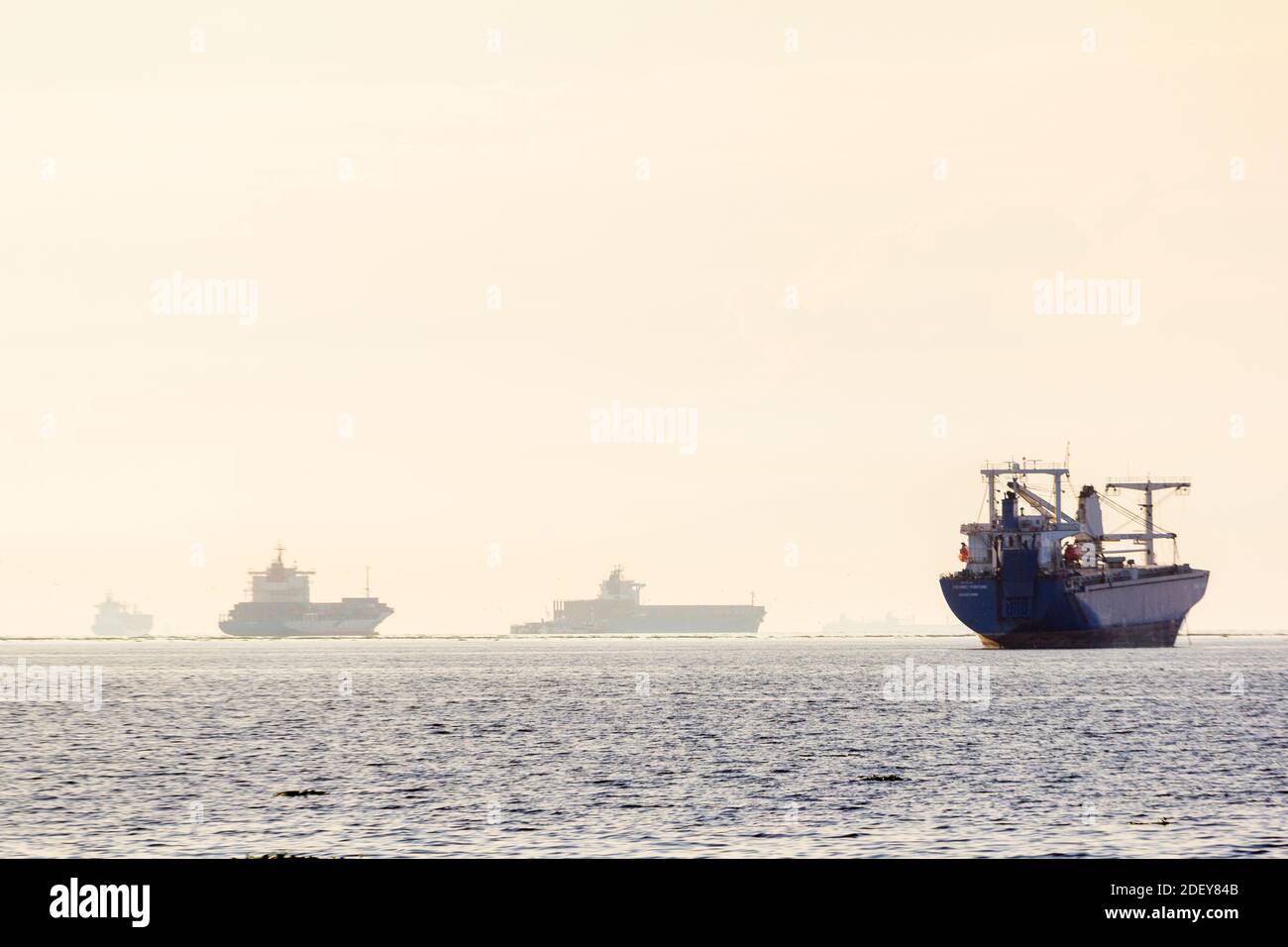 Cargo ships as seen in Manila Bay in the Philippines Stock Photo - Alamy