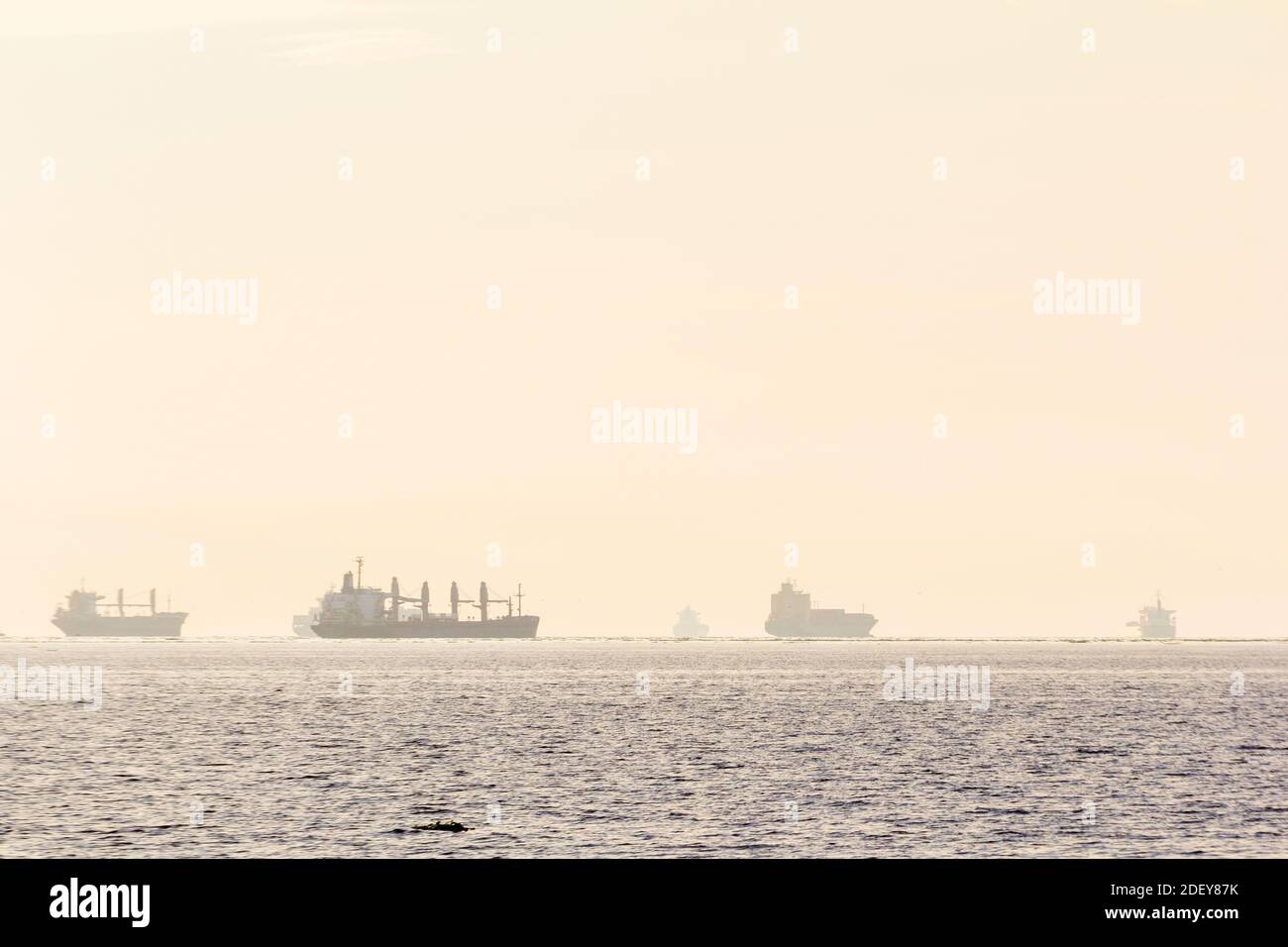 Cargo ships as seen in Manila Bay in the Philippines Stock Photo - Alamy