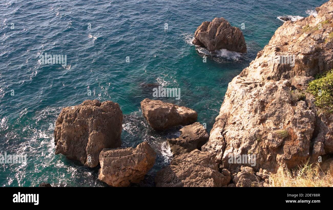 Top view of sea and rocks on the beach Stock Photo - Alamy