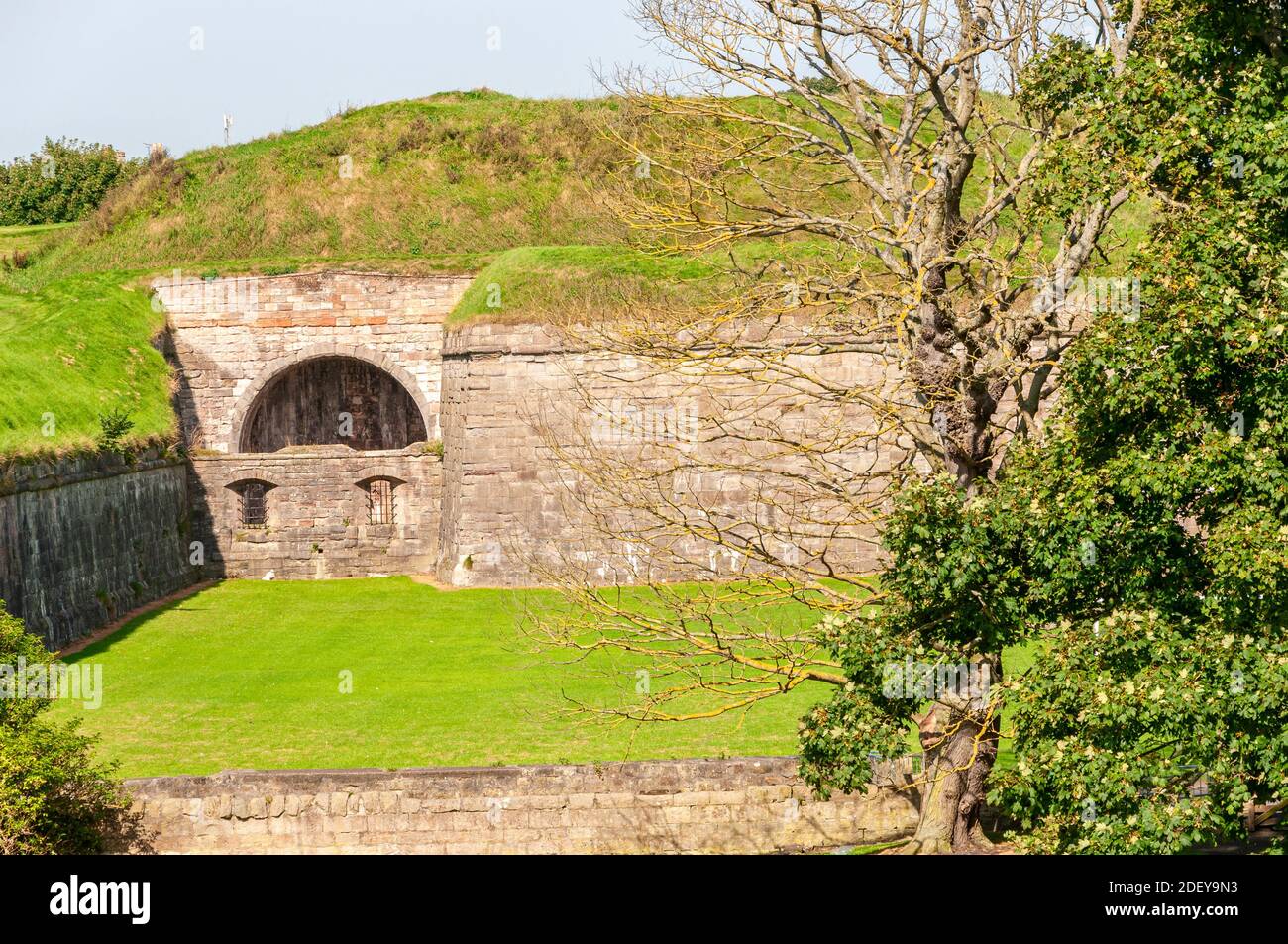 The massive grass topped walls of Brass Bastion protecting the ...