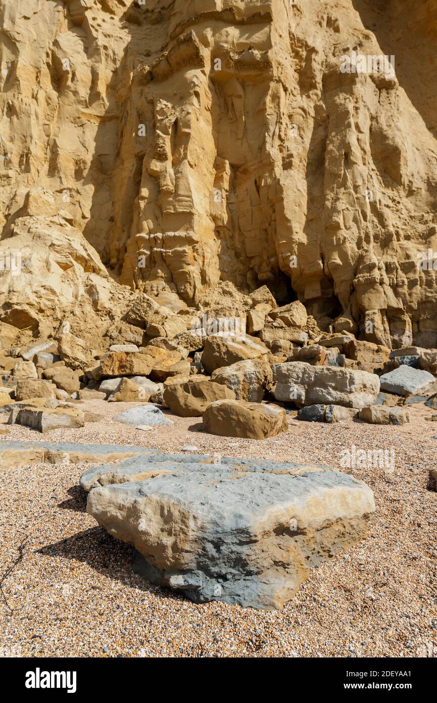 The imposing and eroded sandstone cliffs exposing millions of years of ...