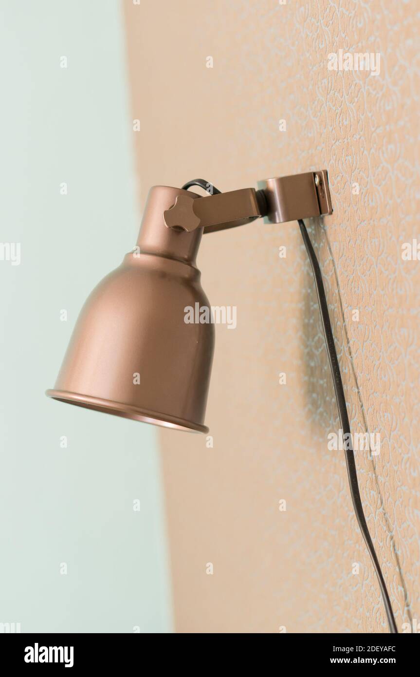 A vertical shot of bronze lamp attached to wall Stock Photo - Alamy