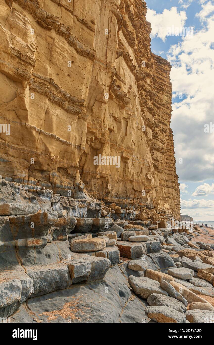 The imposing and eroded sandstone cliffs exposing millions of years of ...