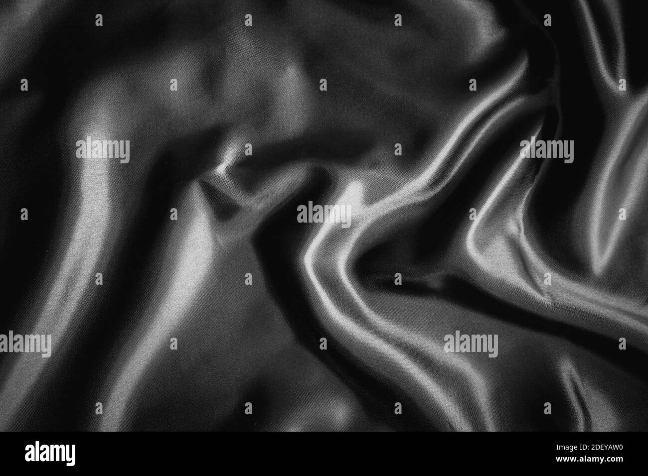 Wrinkle black satin cloth texture background Stock Photo - Alamy