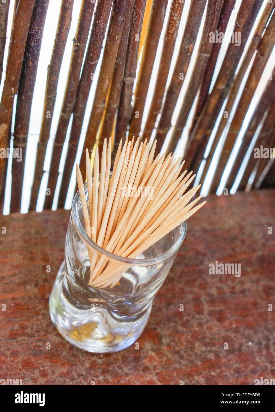 A vertical shot of toothpick sticks in a glass cup Stock Photo - Alamy