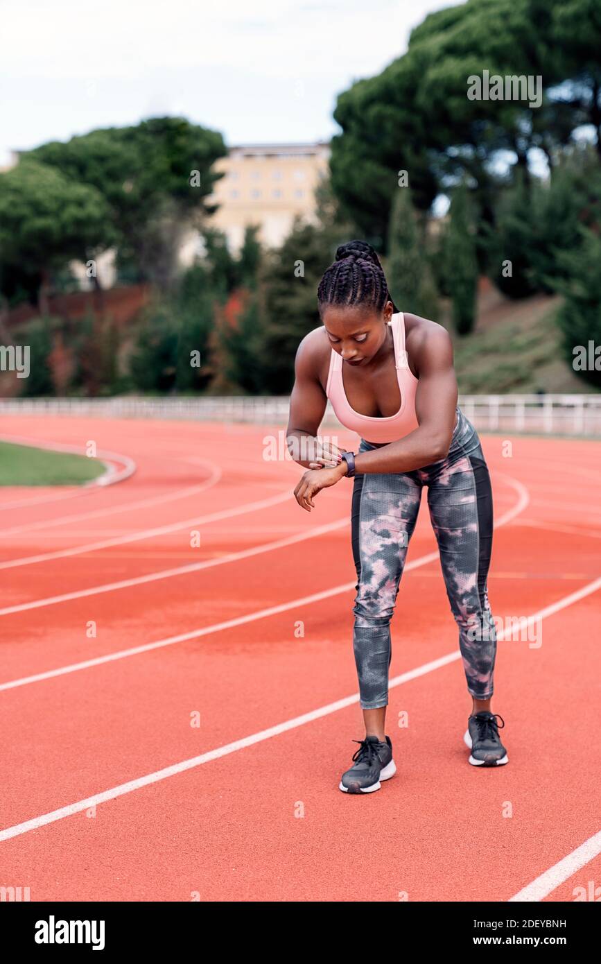 Stock photo of an African-American sprinter standing on an athletics ...