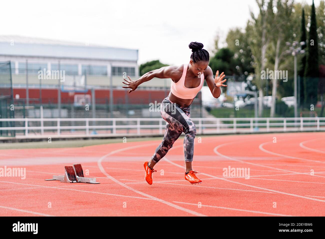 Stock photo of an African-American sprinter running on an athletics ...