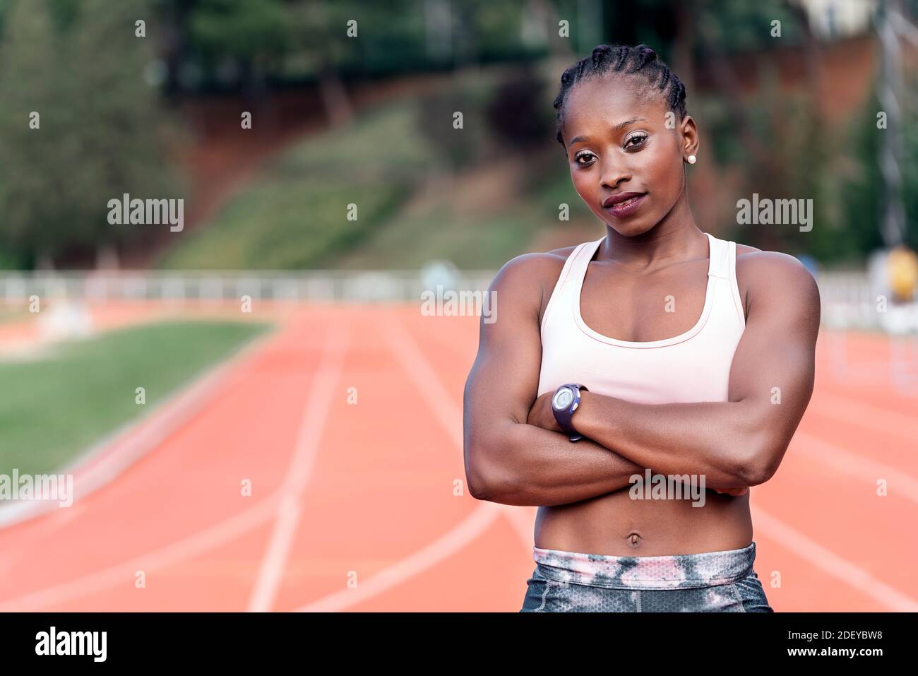 Stock photo of an African-American sprinter standint on an athletics ...