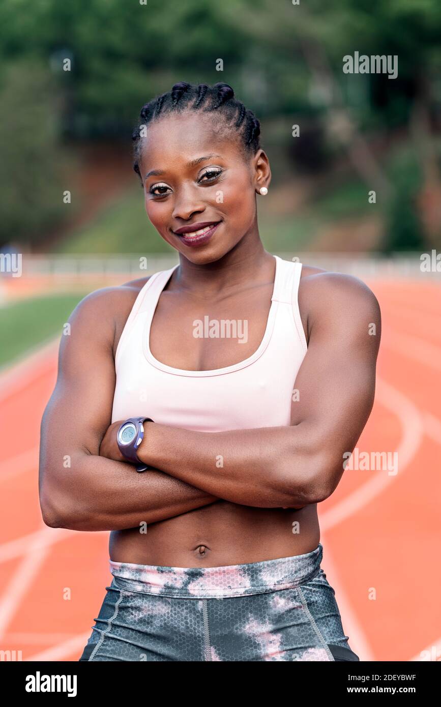 Stock photo of an African-American sprinter standint on an athletics ...