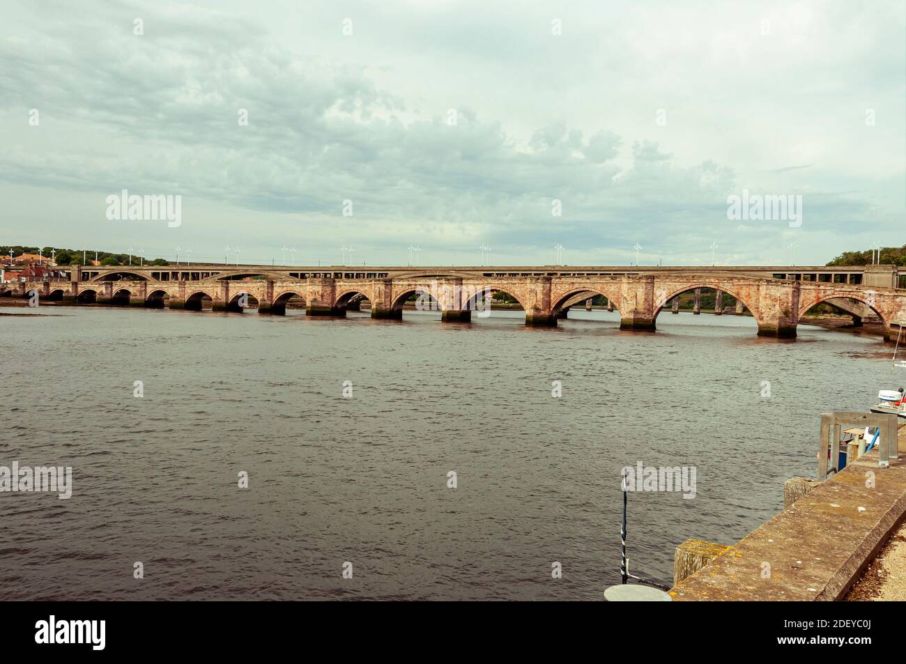 The impressive red sandstone Berwick Bridge crossing over the River ...