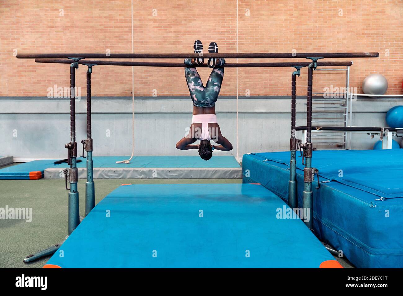 Stock photo of an African-American gymnastic woman practicing on ...