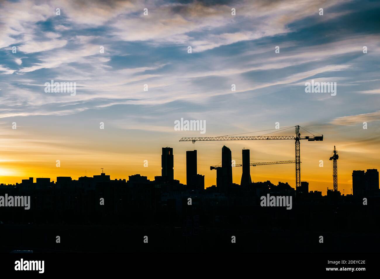 Cuatro Torres Business Area Madrid skyline at sunset with construction ...
