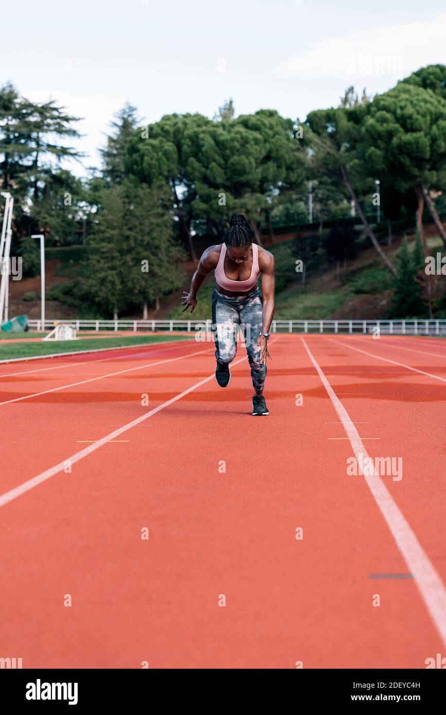 Stock photo of a front view of an African-American sprinter running on ...