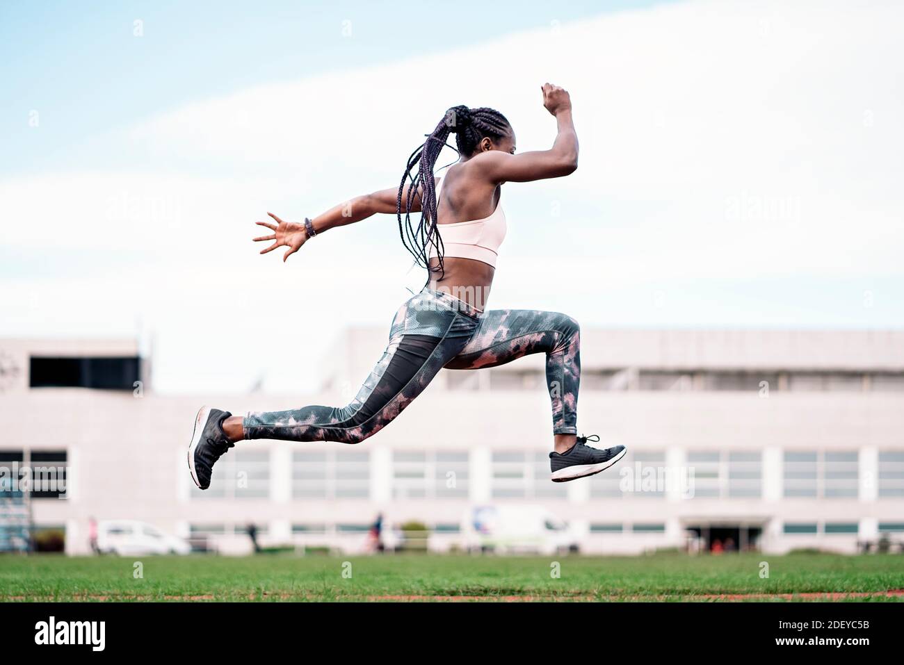 Stock photo of an African-American sprinter jumping in the sports ...