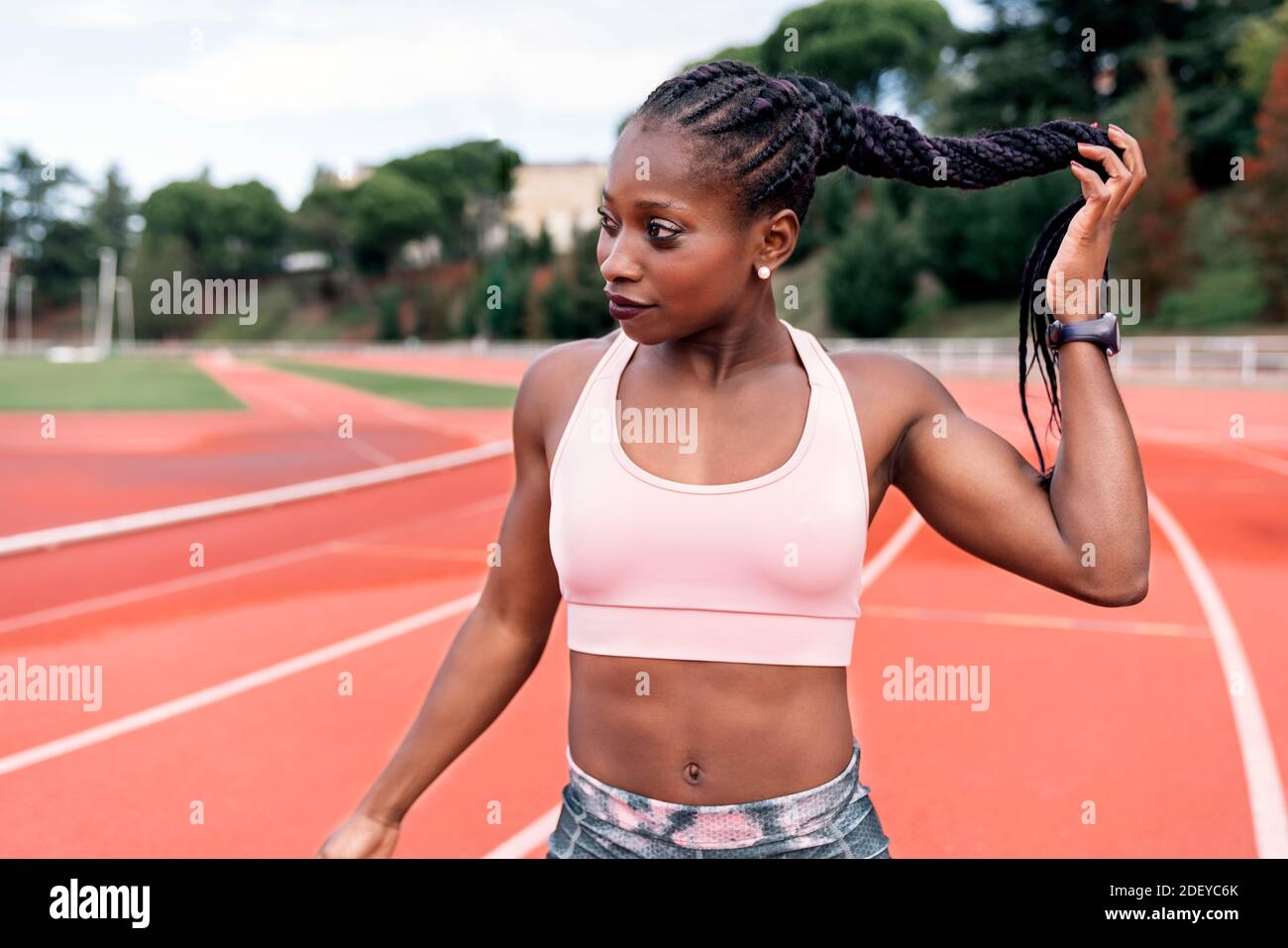 Stock photo of an African-American sprinter standing on an athletics ...