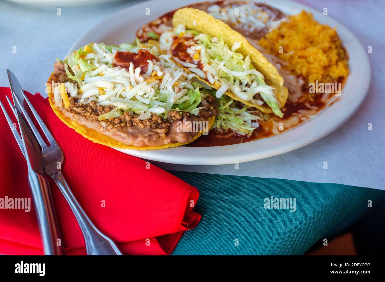 Authentic Mexican taco enchilada and tostada with refried beans and ...