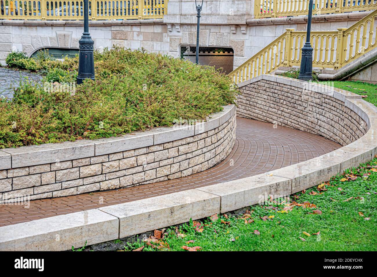 Sidewalk or road descent to the embankment on a city street Stock Photo ...