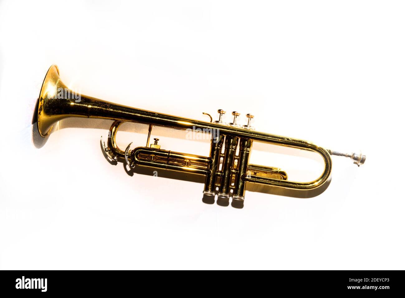 Old rusty Jazz instrument trumpet on plain background Stock Photo - Alamy