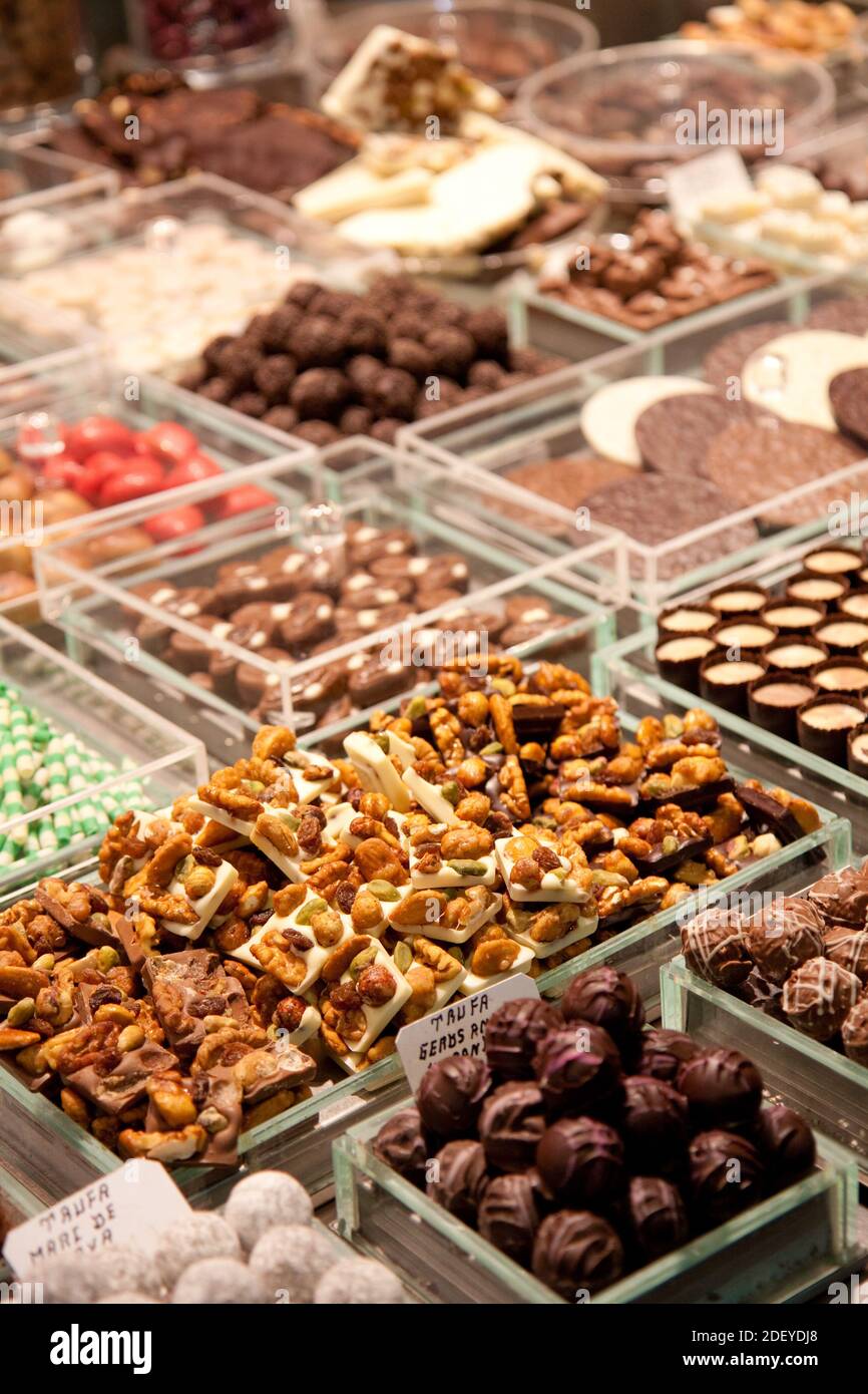 A top view closeup of walnuts and other chocolate sweets in white ...