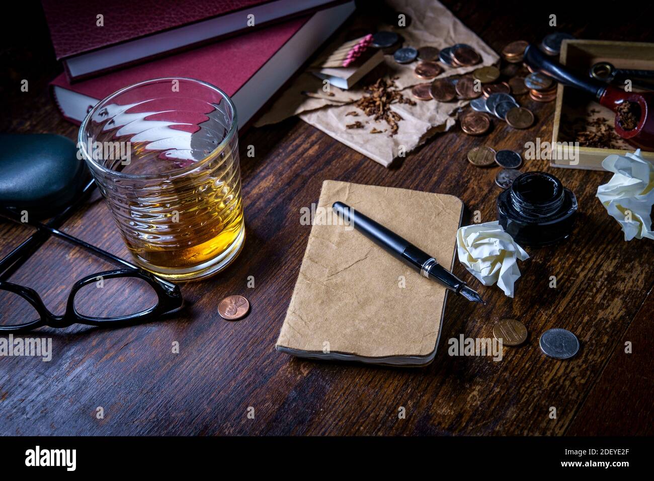 Writer's desk with pen and ink whisky pipe and glasses Stock Photo - Alamy