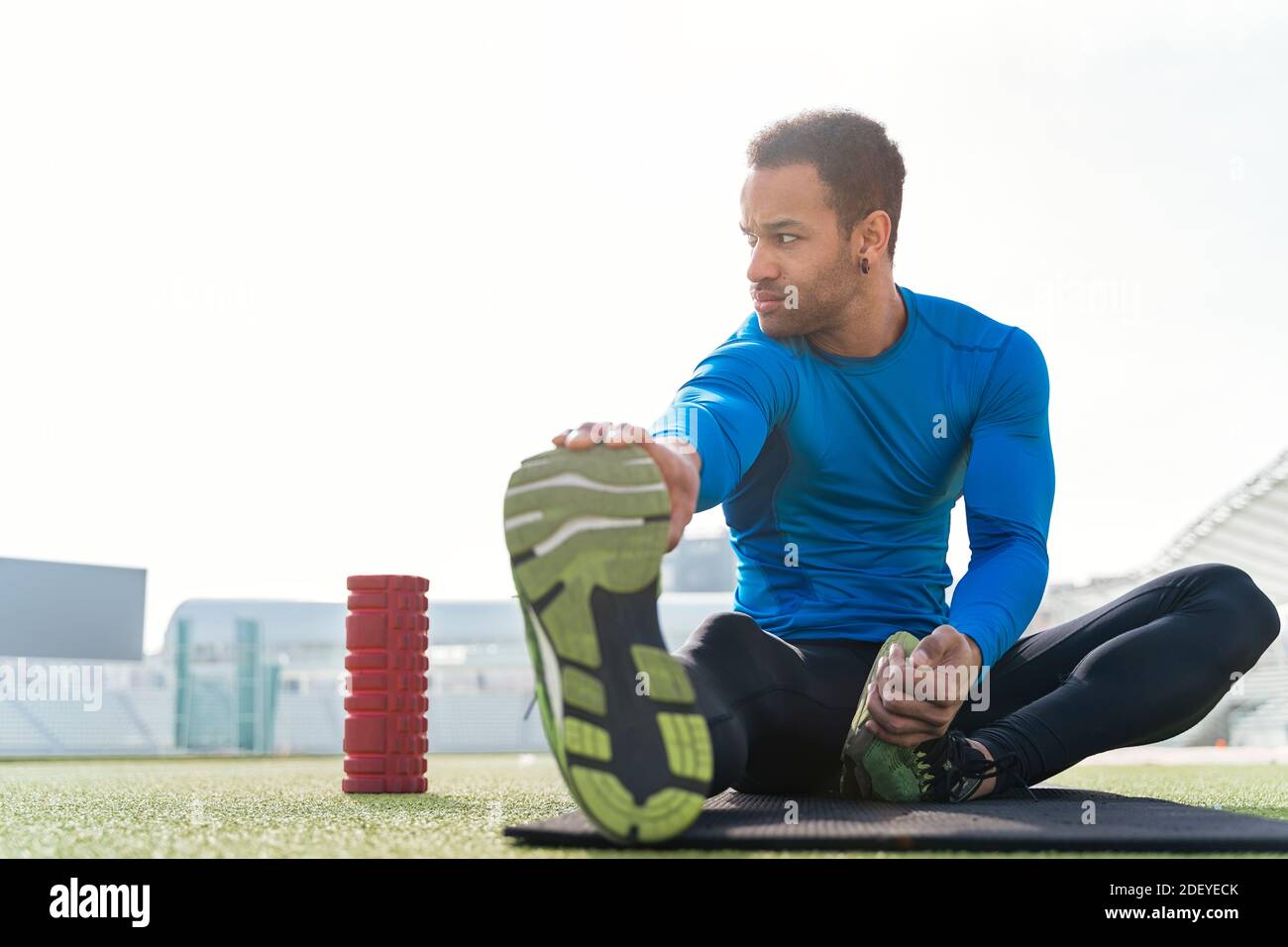Stock photo of african american male athlete sitting on the track ...