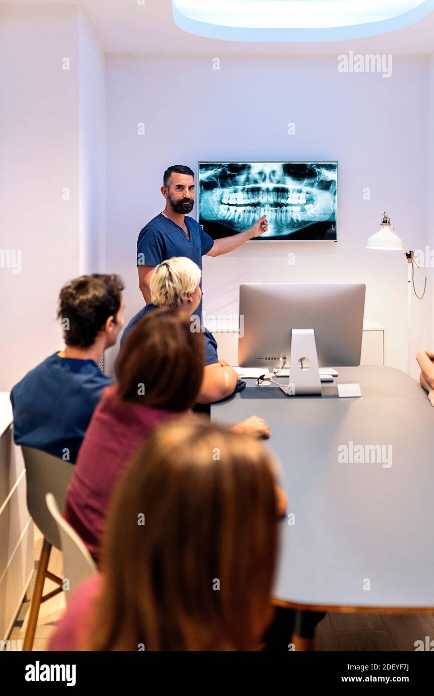 Stock photo of work team of dental clinic during a meeting. The dentist ...