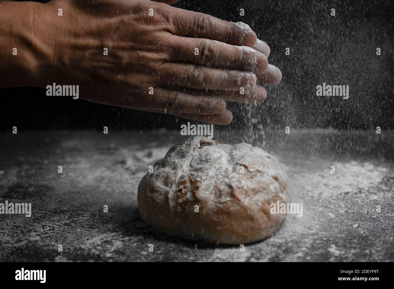 Baker clap hands with flour splash on fresh bread.Bakery, cooking ...
