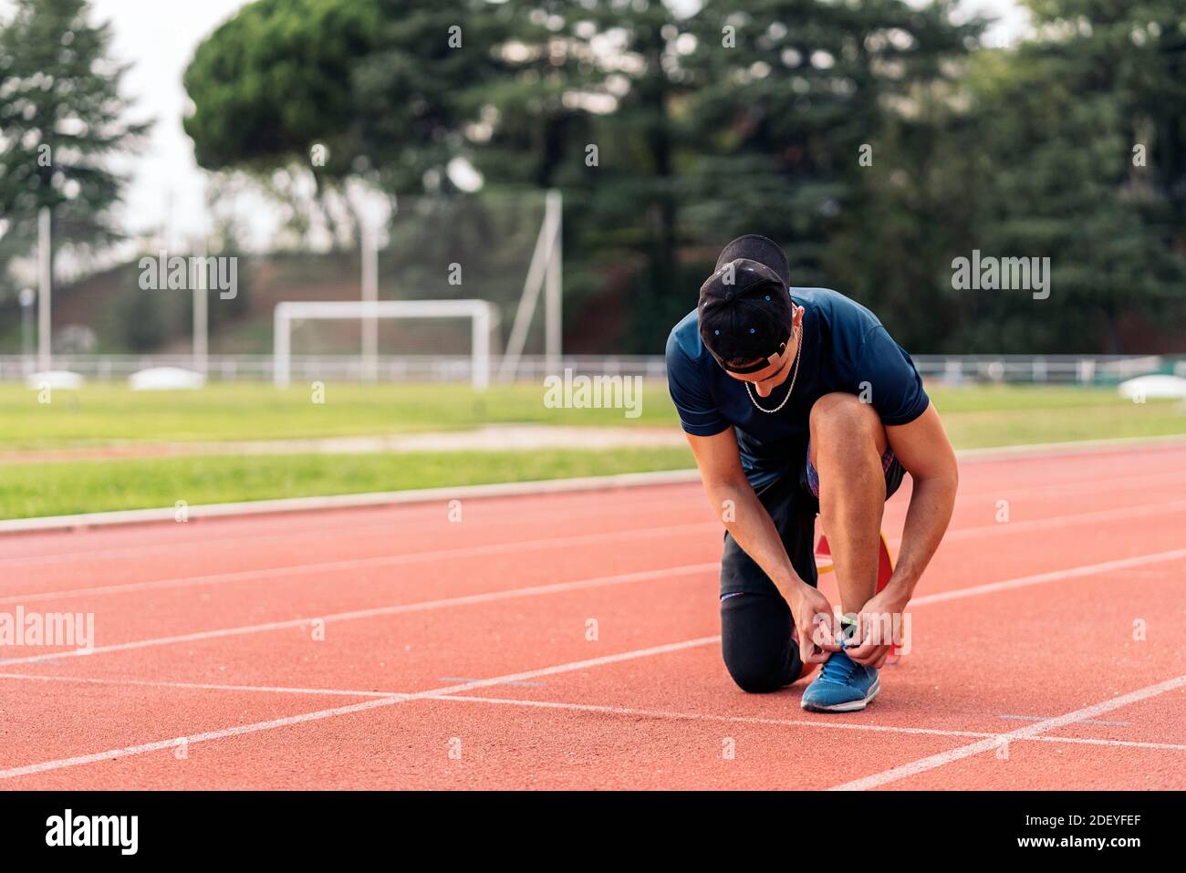 Stock photo of disabled man athlete taking a break and tying his ...