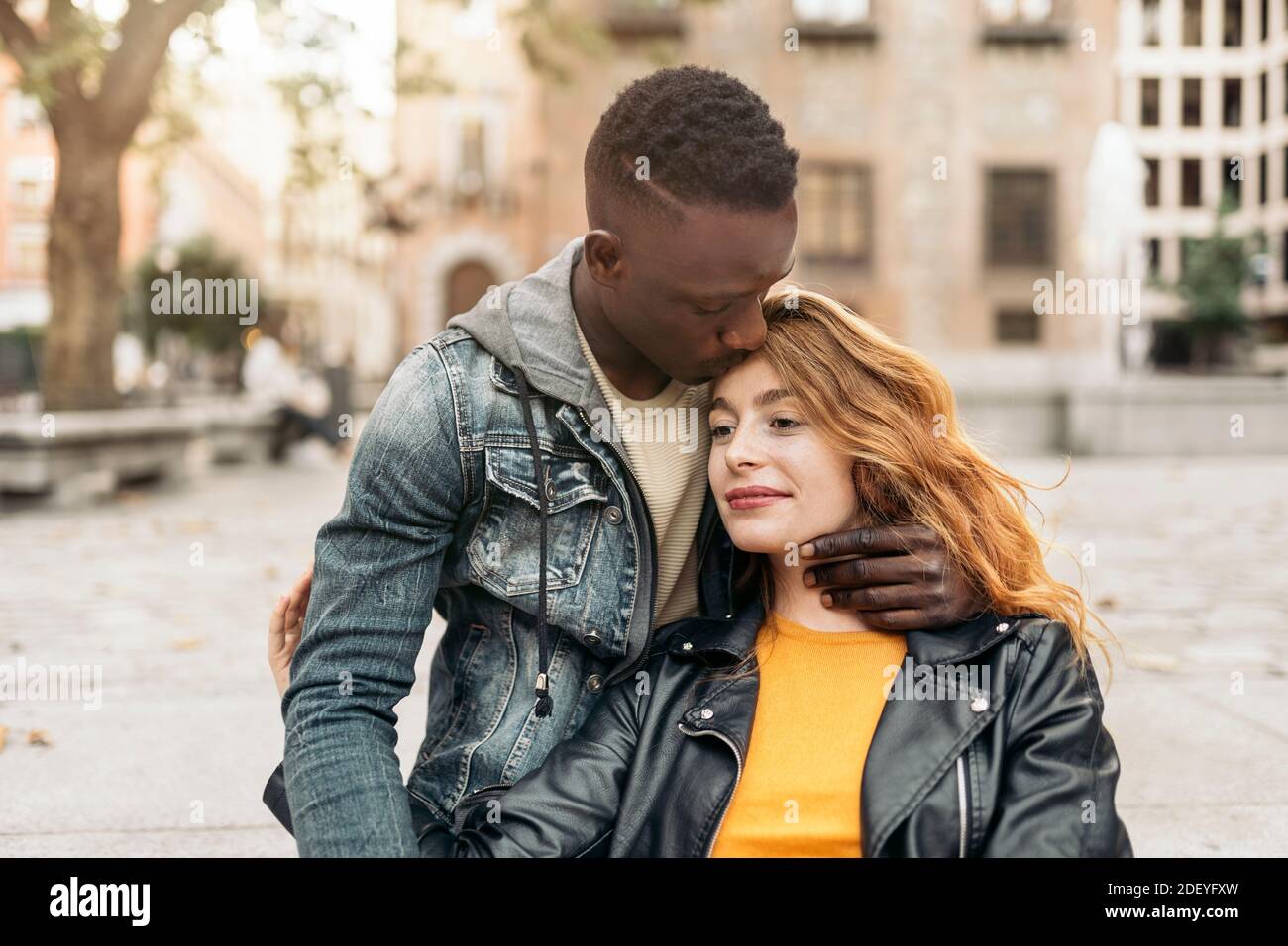 Multiethnic Young Couple Having Romantic Moments Together In The Street