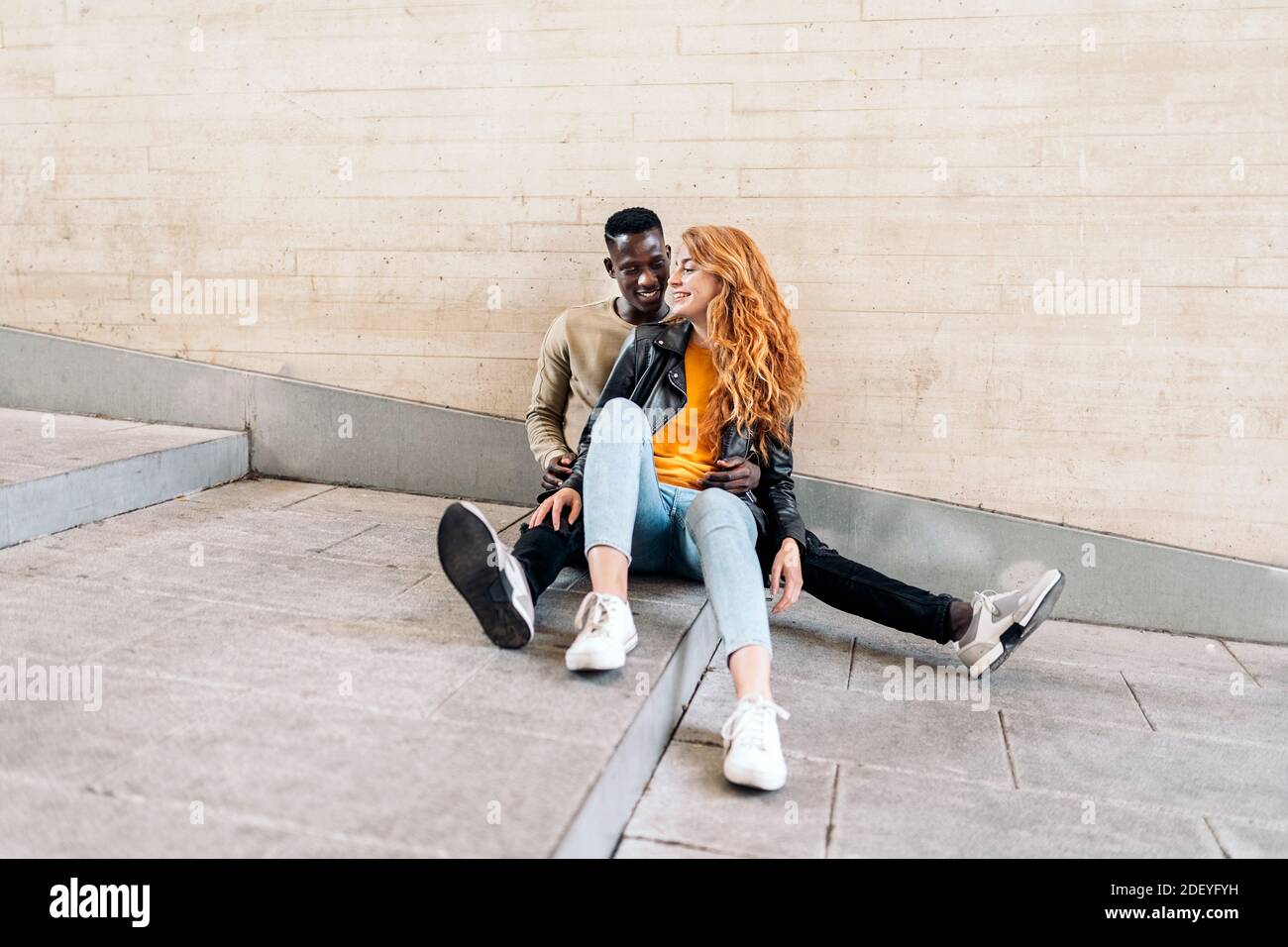 Multiethnic Young Couple Having Romantic Moments Together In The Street