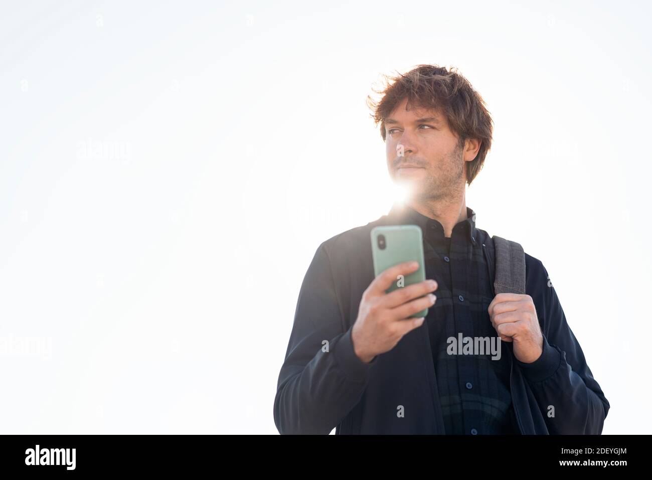 Stock photo of handsome man using his cellphone in the street Stock ...