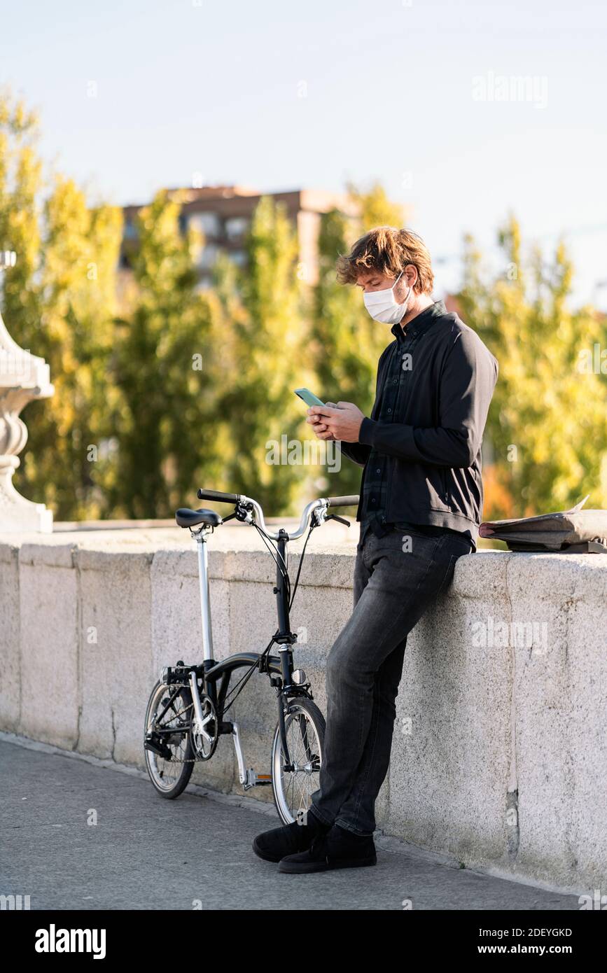 Stock photo of young man using his cellphone in the street Stock Photo ...