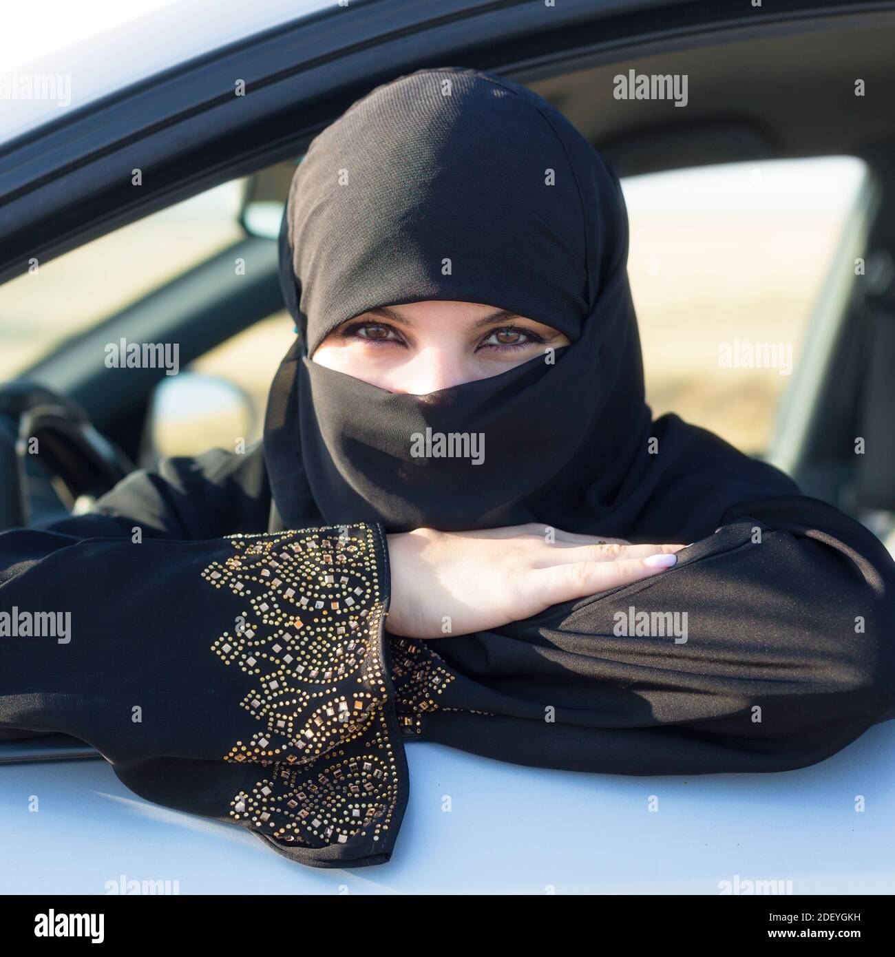 Portrait of woman driving a car. Muslim woman in national dress Stock ...