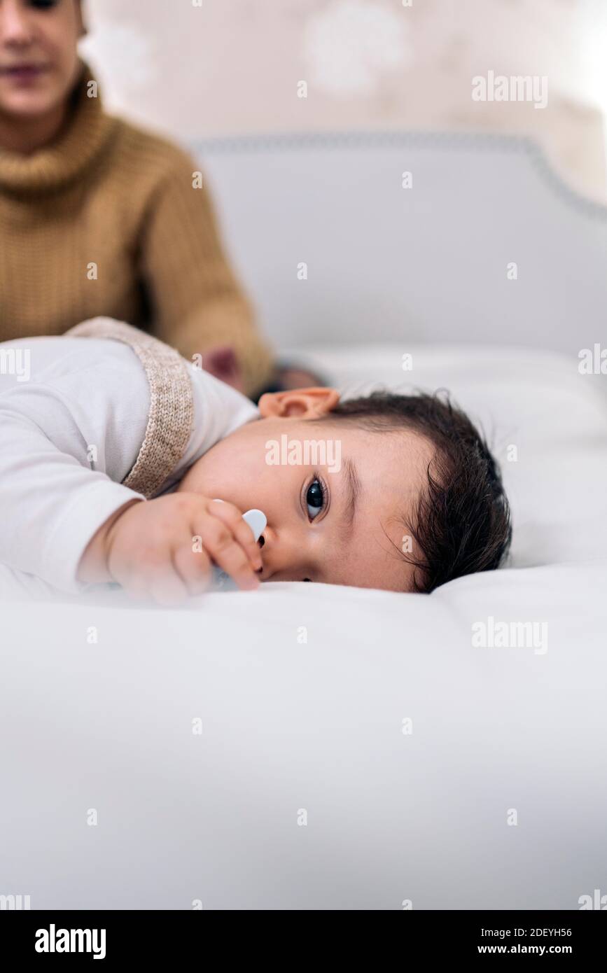 Stock photo of beautiful baby resting with her mom in the bed Stock ...